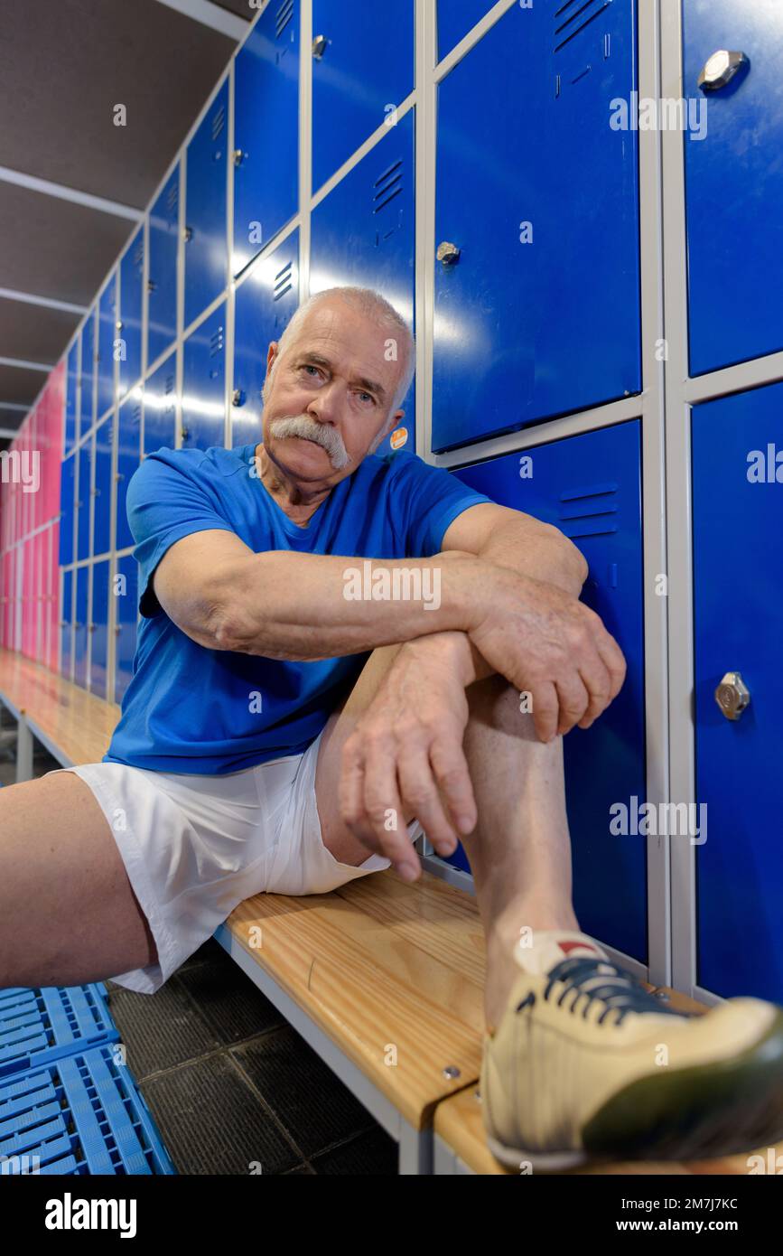 Man changing in locker room hi-res stock photography and images - Alamy