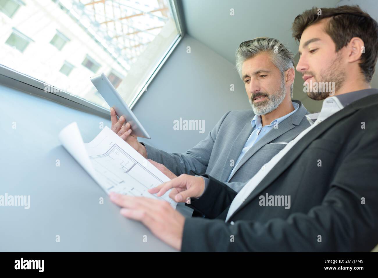 a male architect and apprentice Stock Photo - Alamy