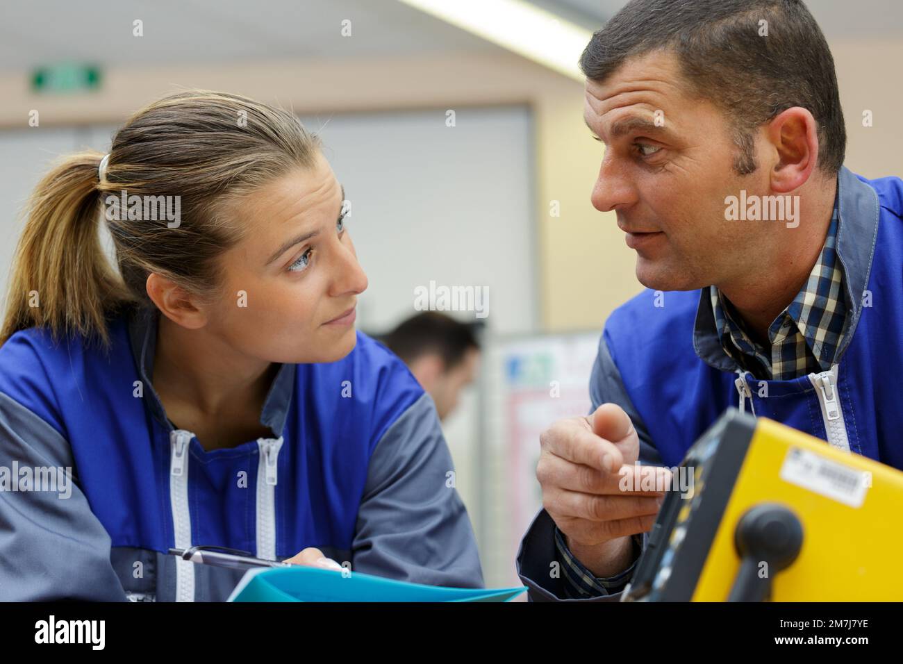 a factory supervisor giving instructions Stock Photo - Alamy