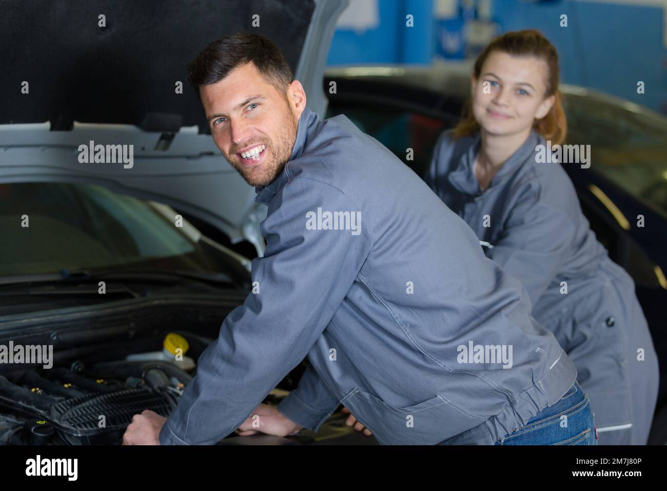 car service technician repairing engine Stock Photo - Alamy
