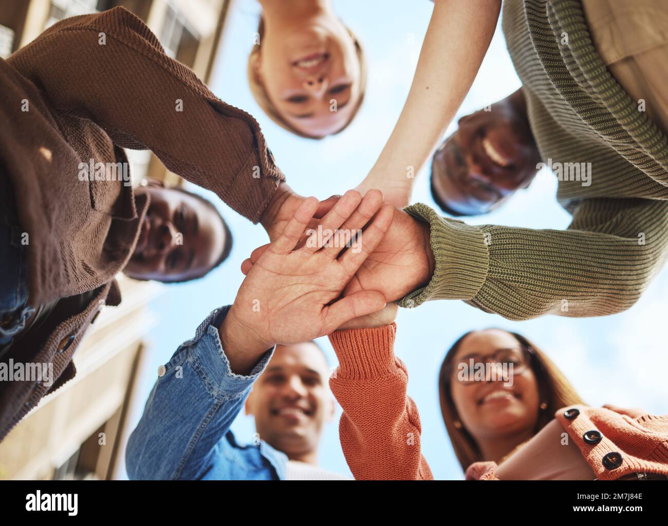 Friends smile, hands together in huddle and group diversity, team ...