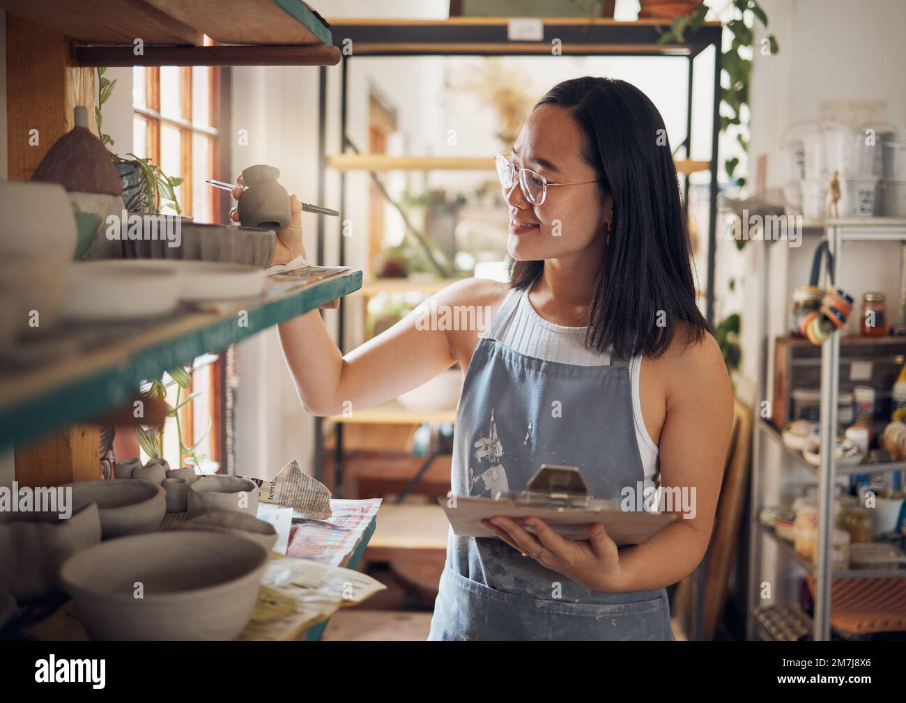 Pottery, woman or small business owner with inventory, stock and ...