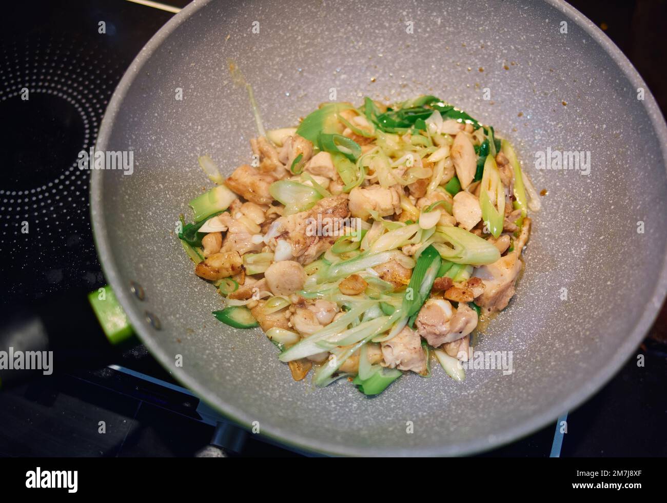 Stir-fry pork and scallion in a frying pan Stock Photo - Alamy