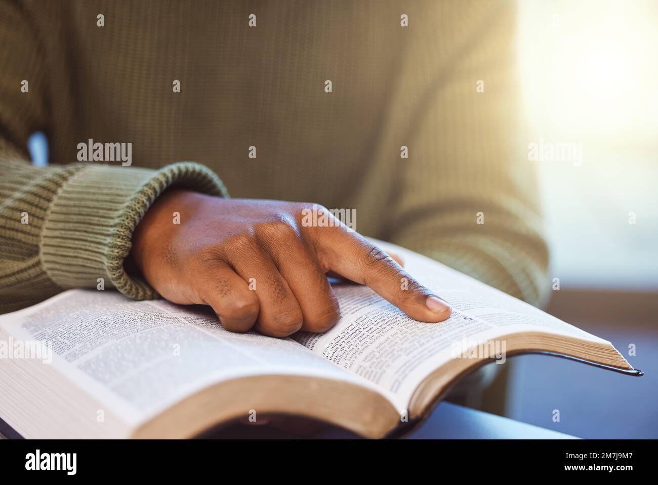 Hands, black man and reading books for knowledge, library and college ...
