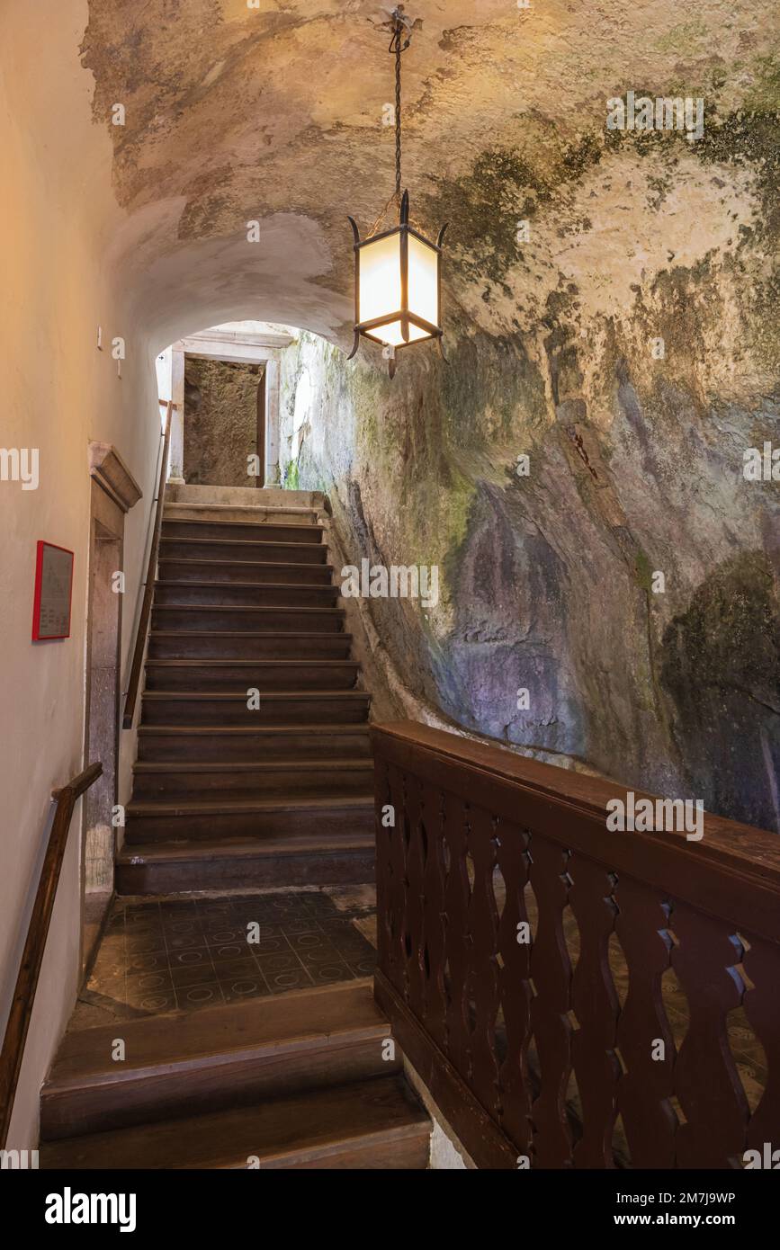 Walking through Predjama castle inside the cave Stock Photo - Alamy
