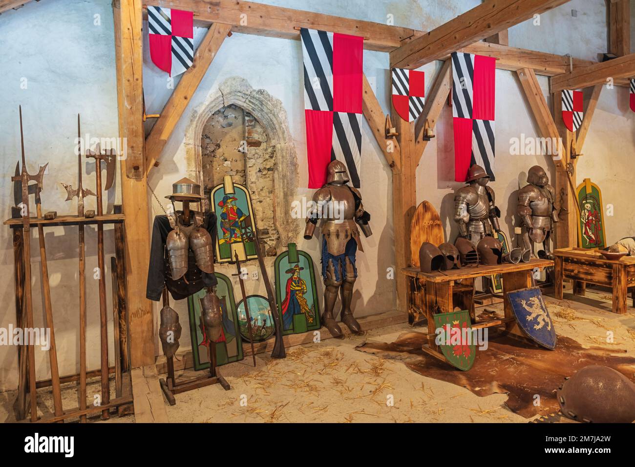 Display of medieval weapons in the Predjama Castle Stock Photo - Alamy