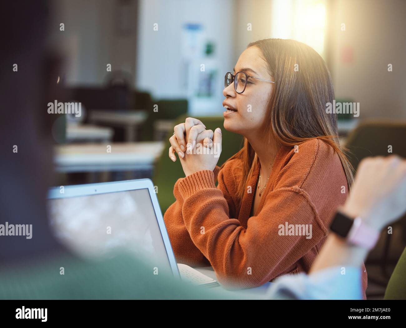 Woman, student and speaking in class, analysis and answer question for ...