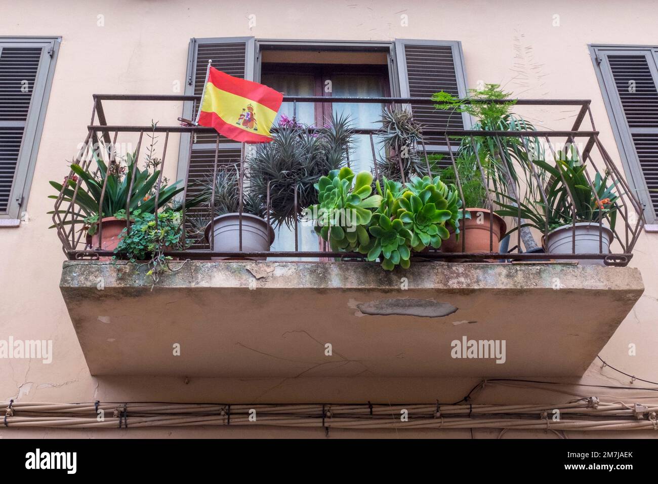 Balcony with Spanish flag in Porto Cristo, Mallorca Stock Photo - Alamy