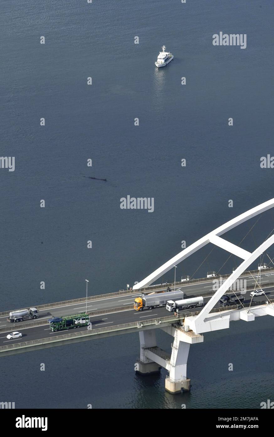 Photo taken from a Kyodo News helicopter shows a coast guard vessel ...