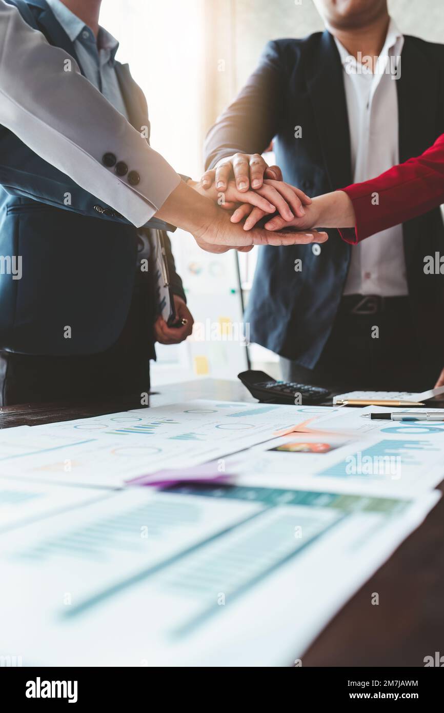 Close up Asian Business people stack of hands working together. Teamwork, Unity, business team ...