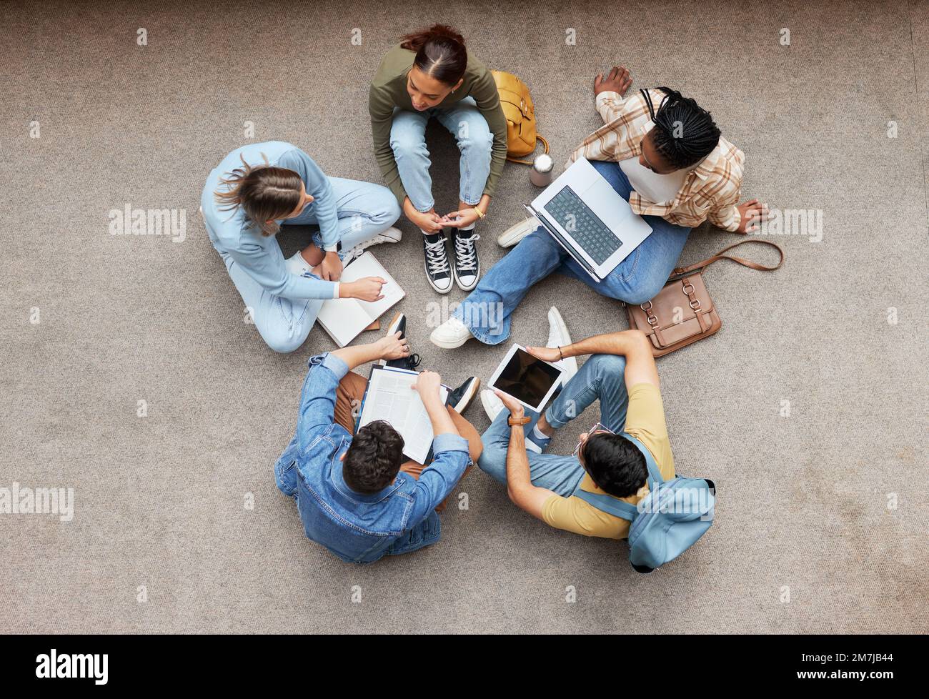 Study, laptop and group of students on floor in project, research or ...