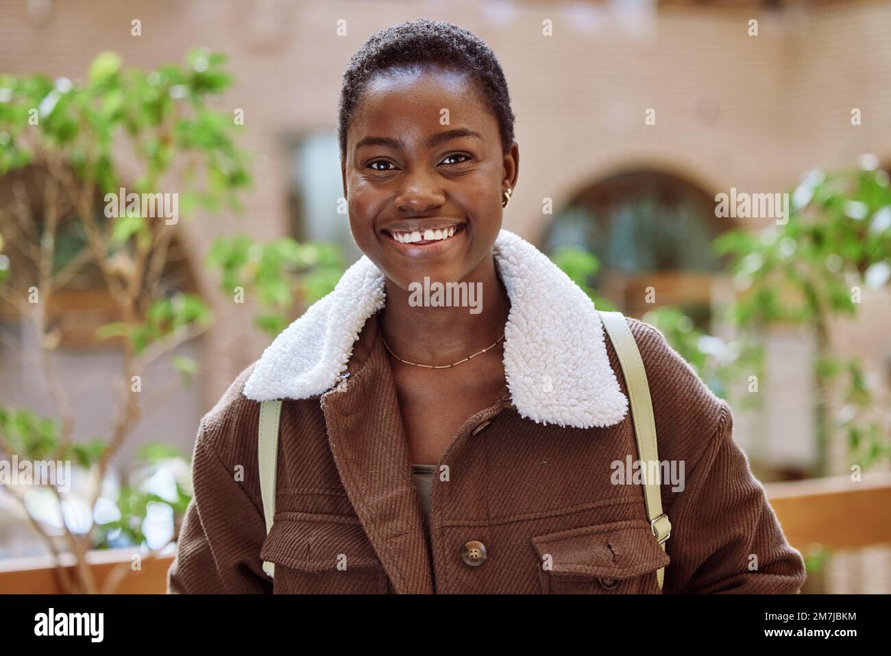 Happy, portrait and black woman student at college standing in an ...