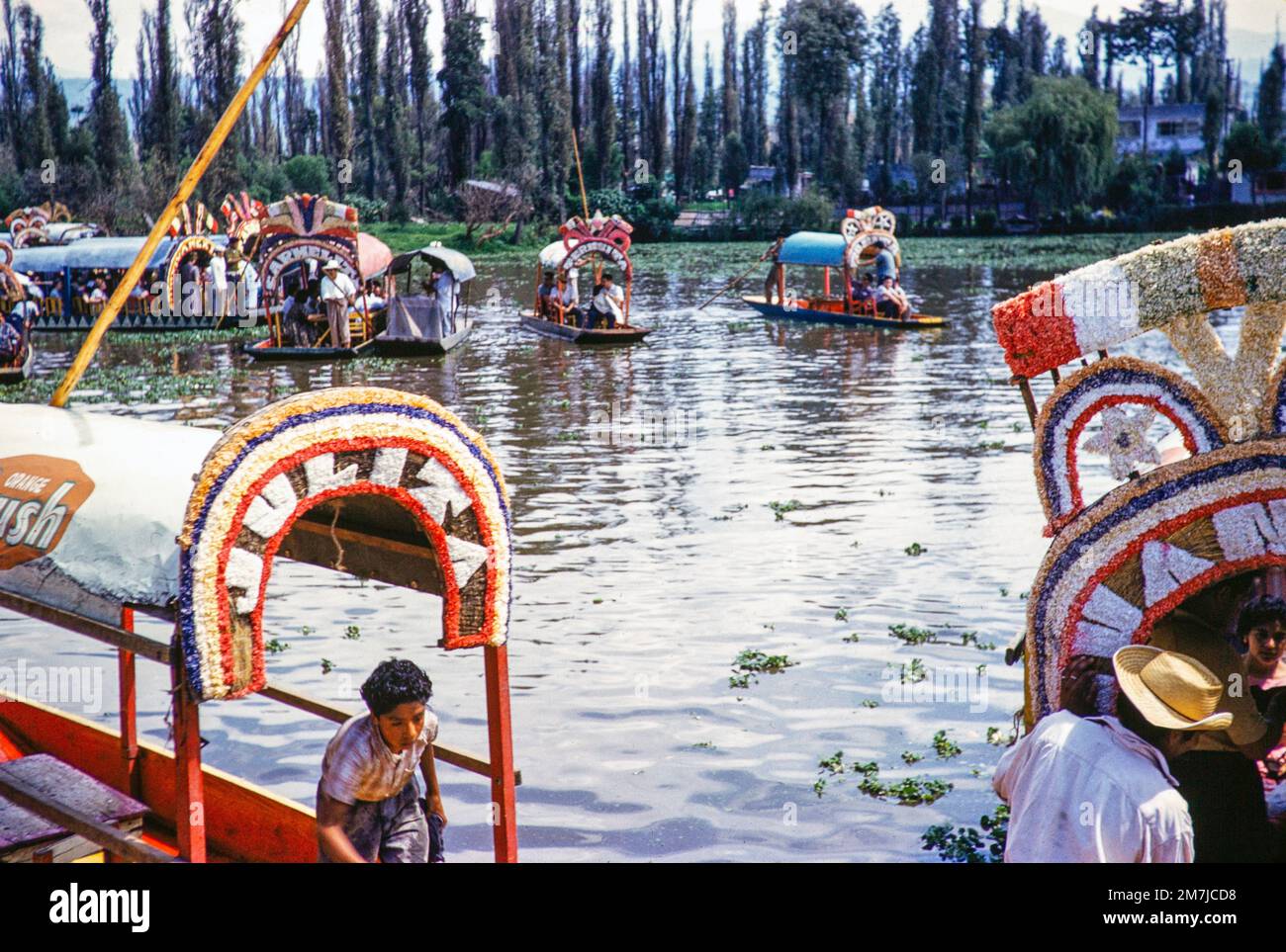 People punting on boats on canalas at Xochimilco, Ciudad de México ...
