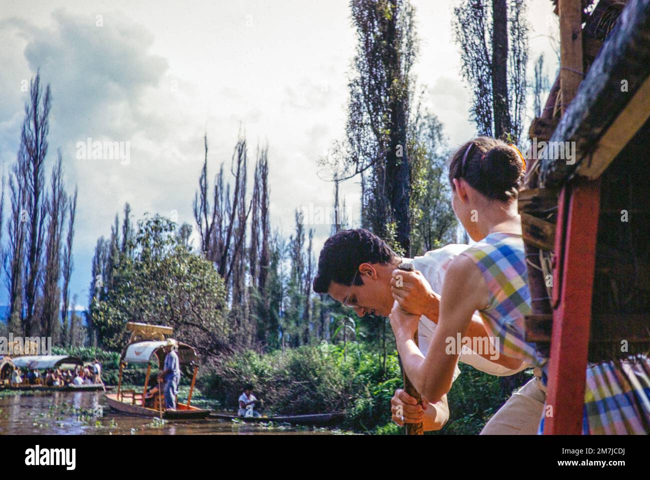 People punting on boats on canalas at Xochimilco, Ciudad de México ...