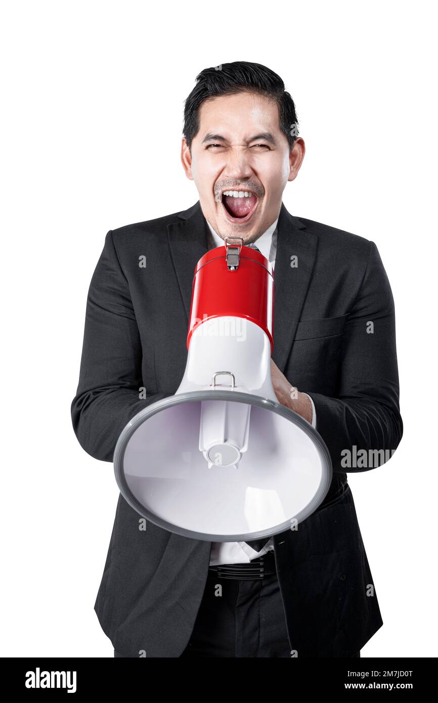 Asian businessman shouting on megaphone isolated over white background ...