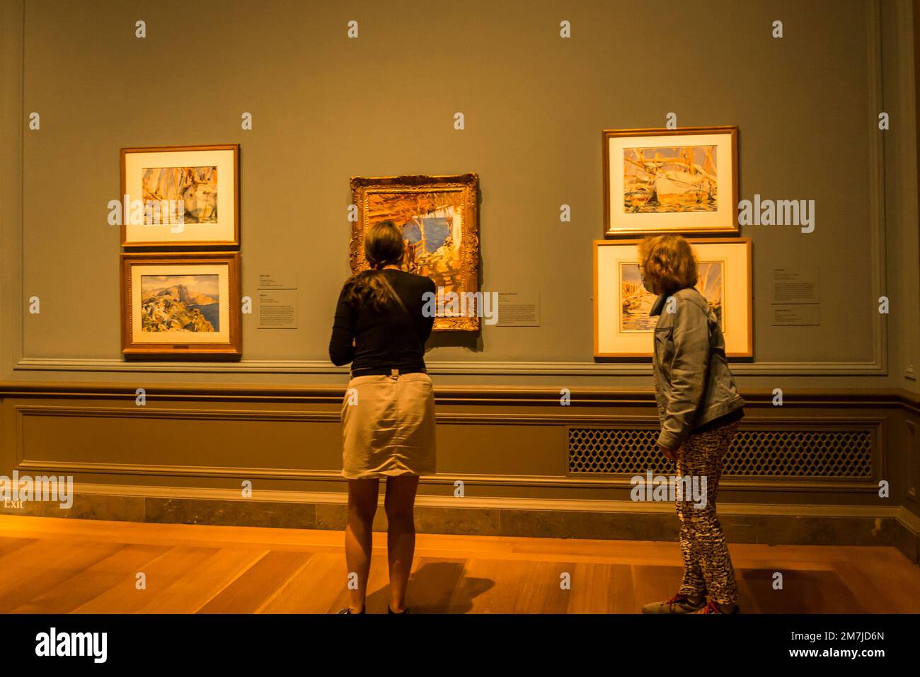 Two women looking at the paintings in the 'Sargent and Spain' exhibition, National Gallery of ...