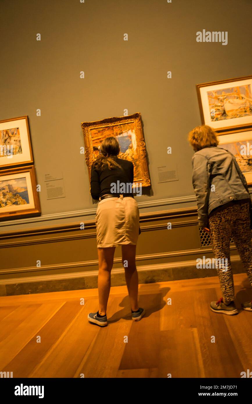 Two women looking at the paintings in the 'Sargent and Spain' exhibition, National Gallery of ...