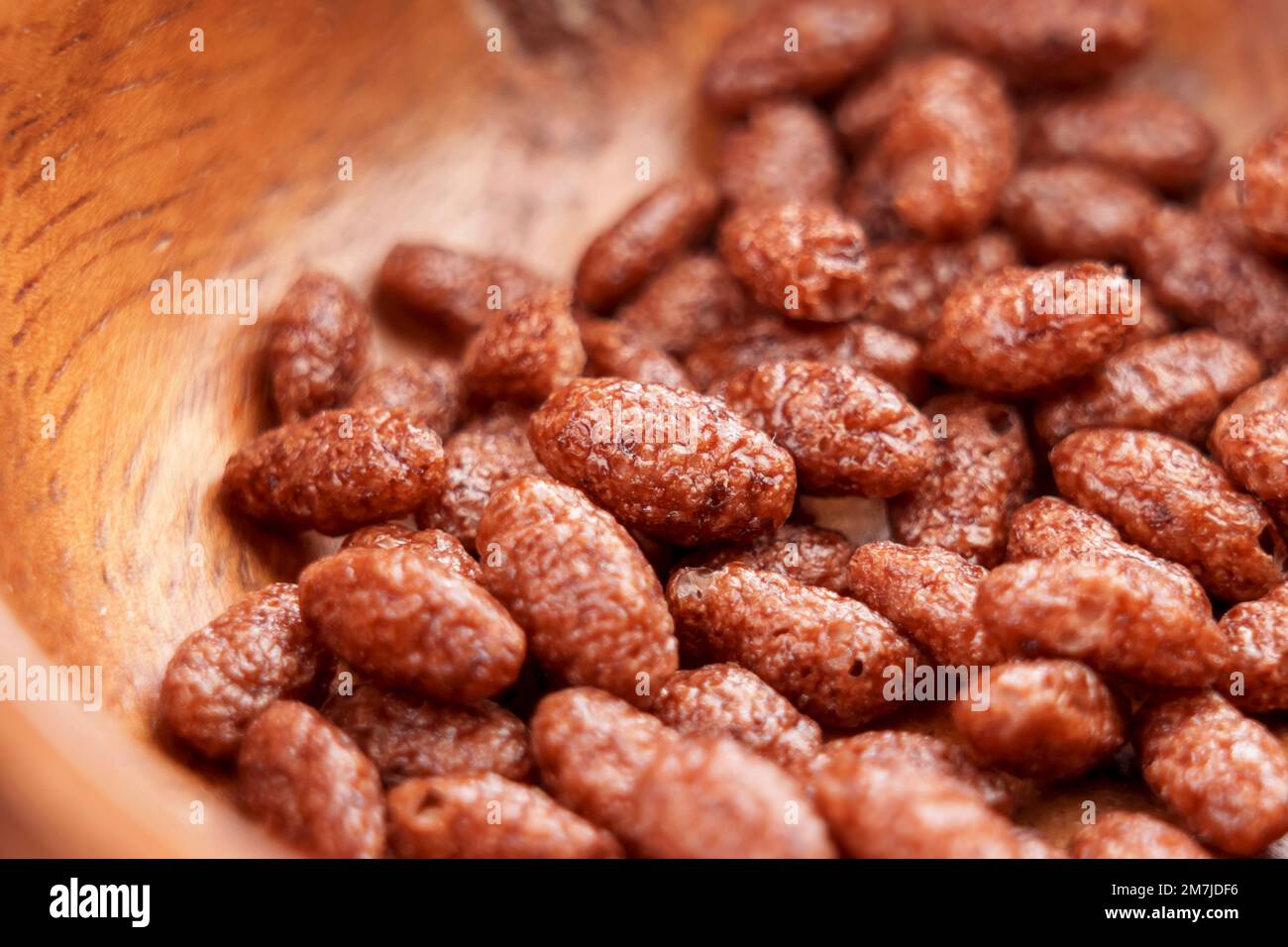 Chocolate cereal puffed rice flakes in wooden rustic bowl. Crispy ...