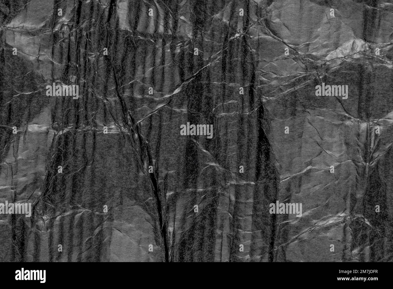 Crumpled black paper. Corrugated wrinkled cardboard layer Stock Photo ...