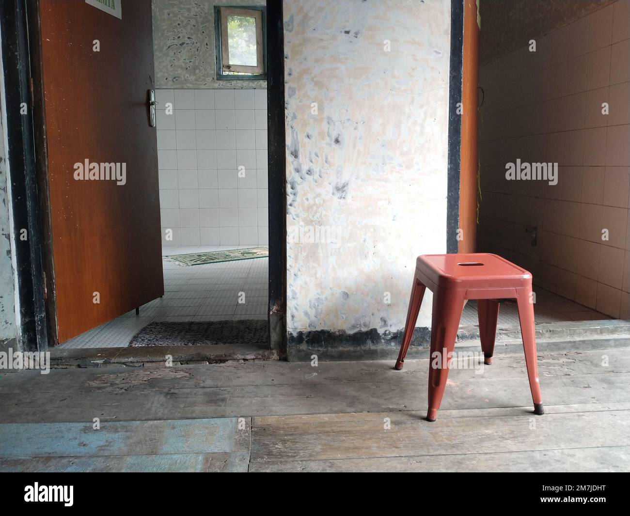 photo of a two empty spaces with a chair in front of it Stock Photo - Alamy