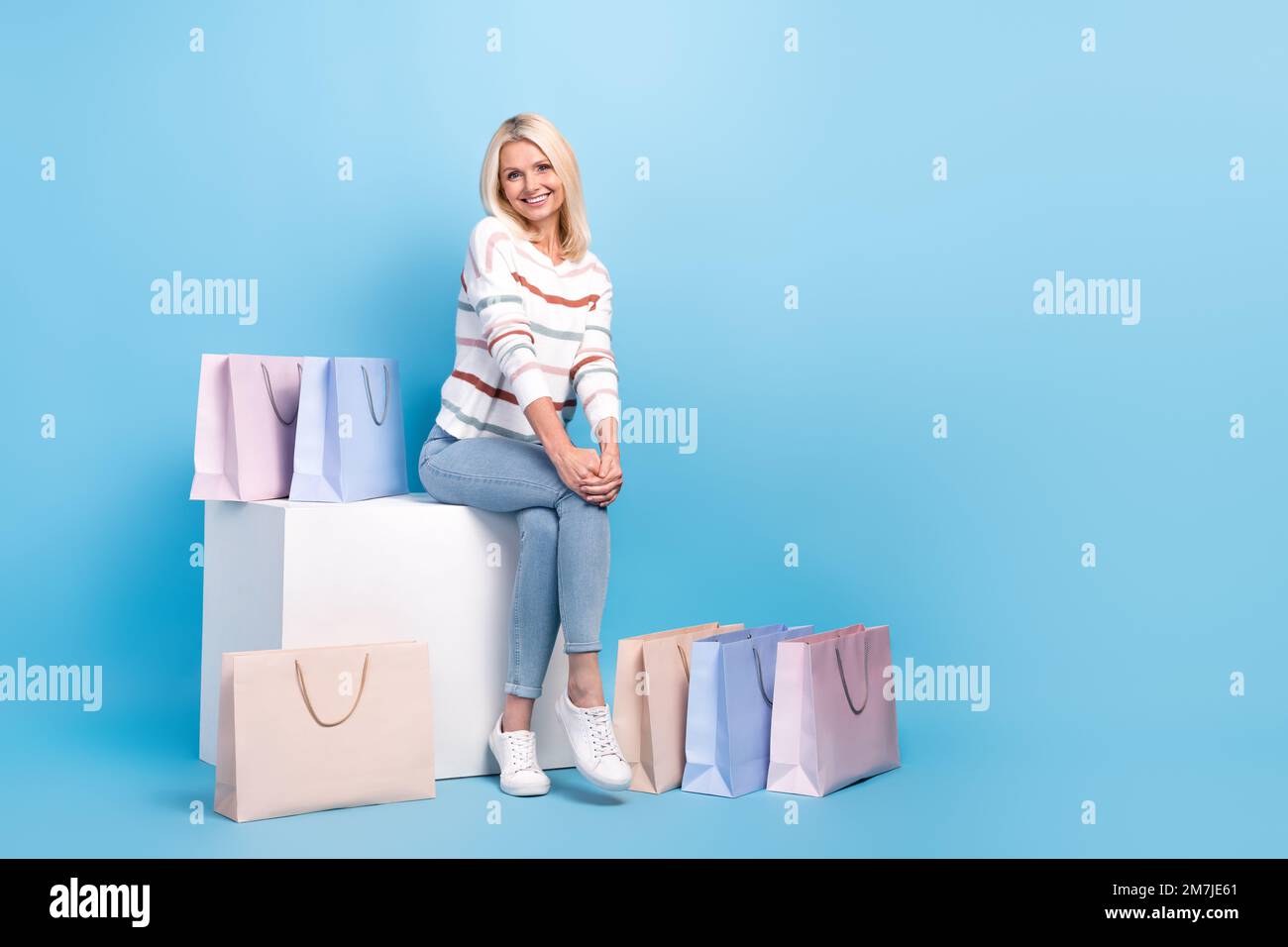 Photo of positive stunning lady on podium presenting news opening mall ...