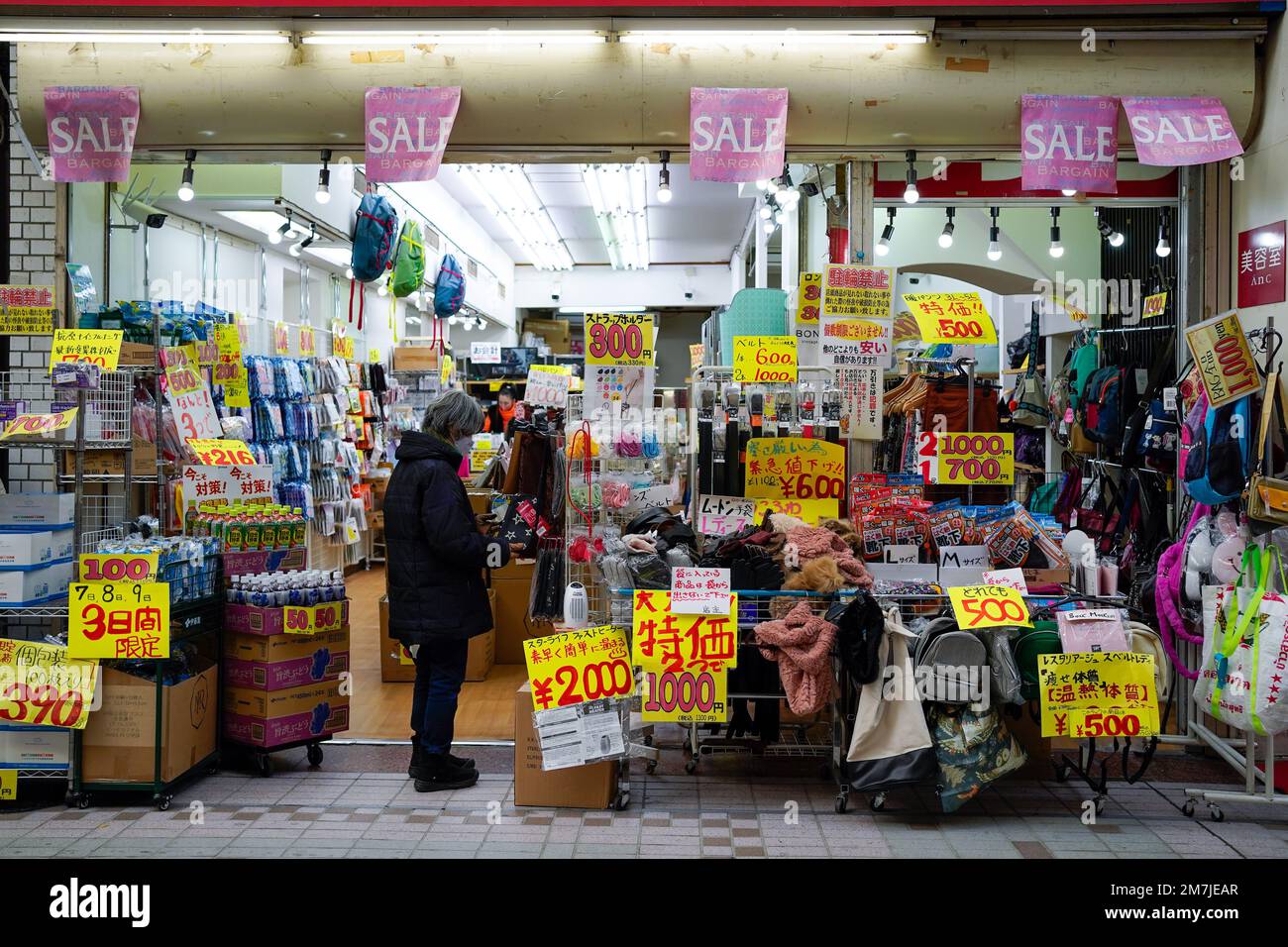 Tokyo, Japan. 10th Jan, 2023. A shopper looks at products at a shop in ...