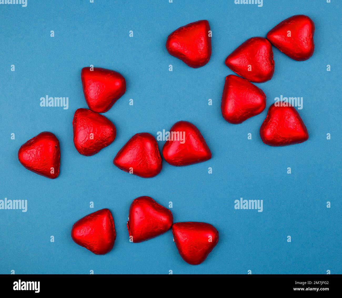 A closeup of red heart candies in white background Stock Photo - Alamy