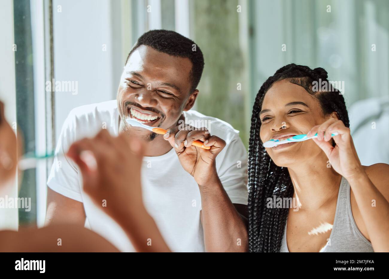 Brushing teeth, dental and oral hygiene with a black couple grooming ...