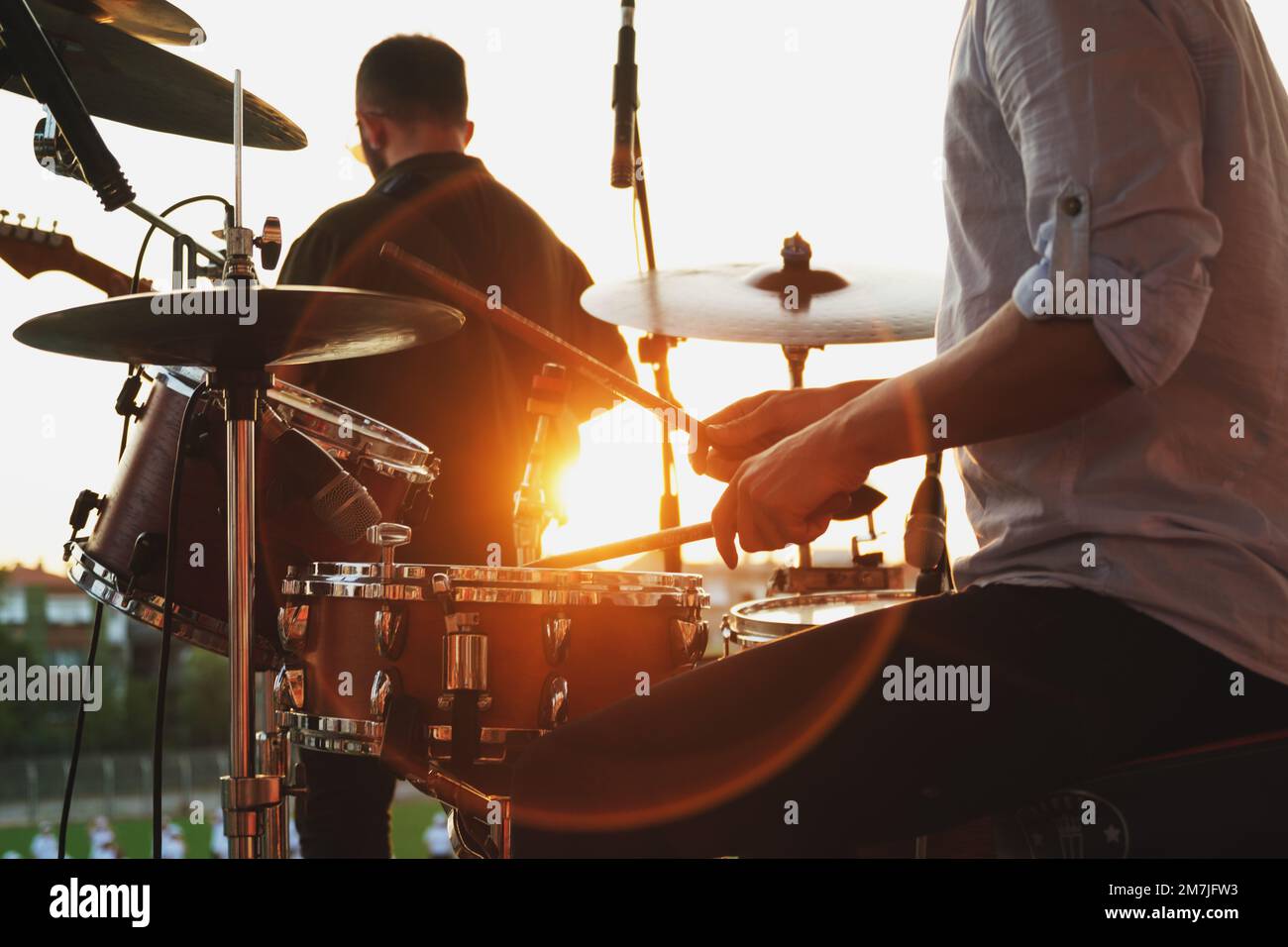 Close up shot of drum set and drummer on a concert Stock Photo - Alamy