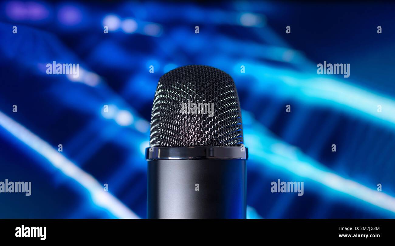 Condenser microphone on a blue tech background. Concept recording audio ...