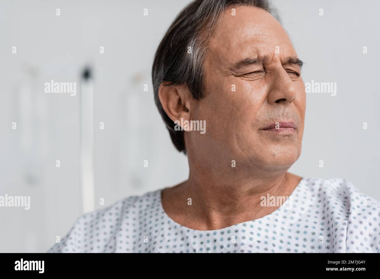 Sick senior patient suffering from pain in clinic,stock image Stock ...