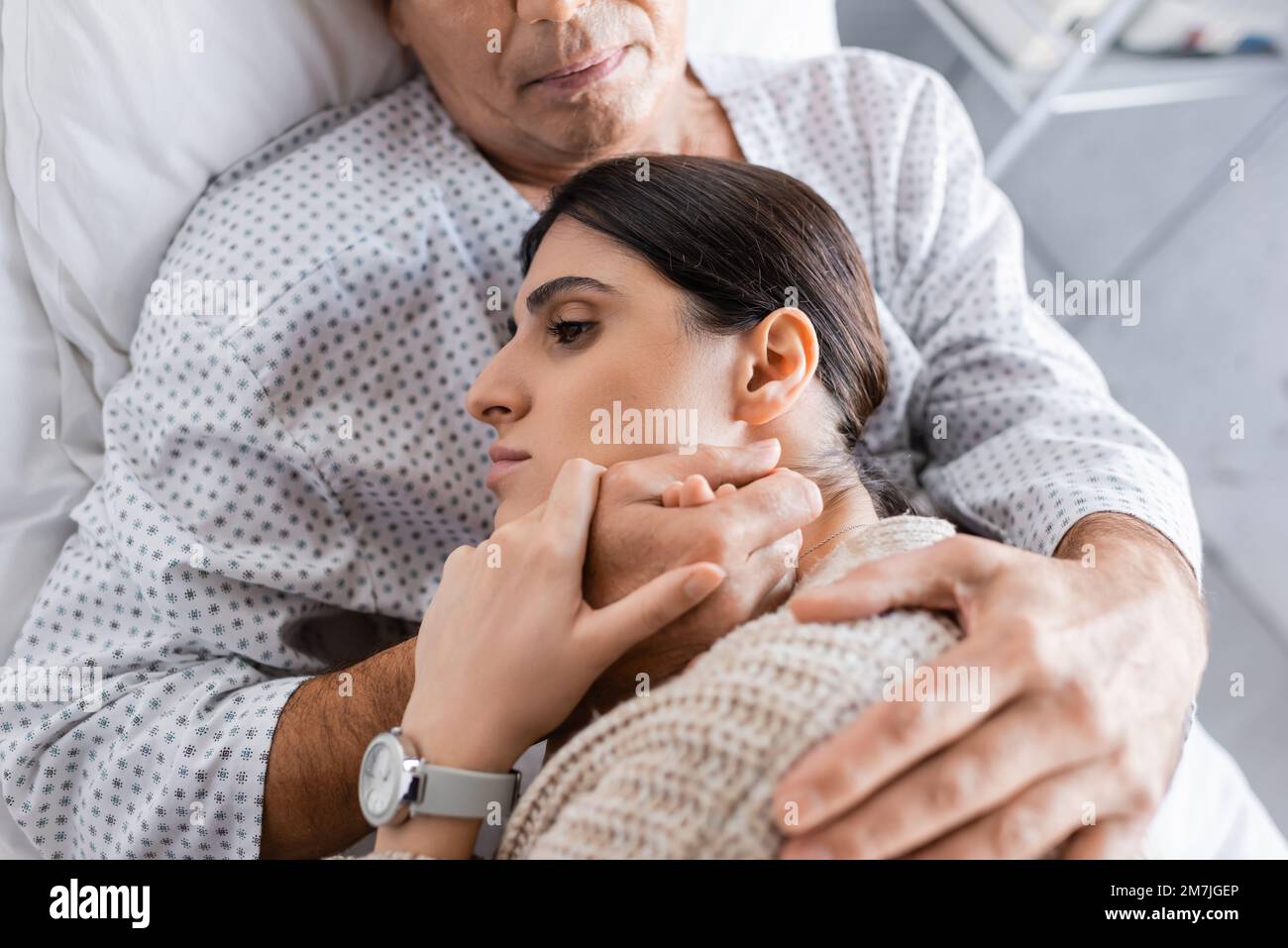 Top view of sick elderly patient hugging daughter in clinic,stock image ...