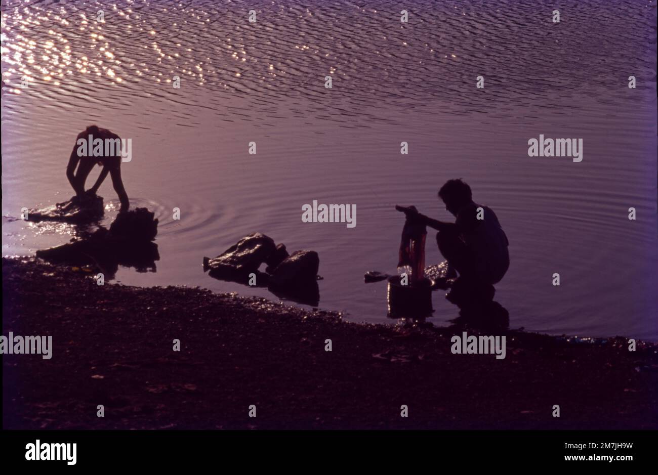 Villagers washing clothes hi-res stock photography and images - Alamy