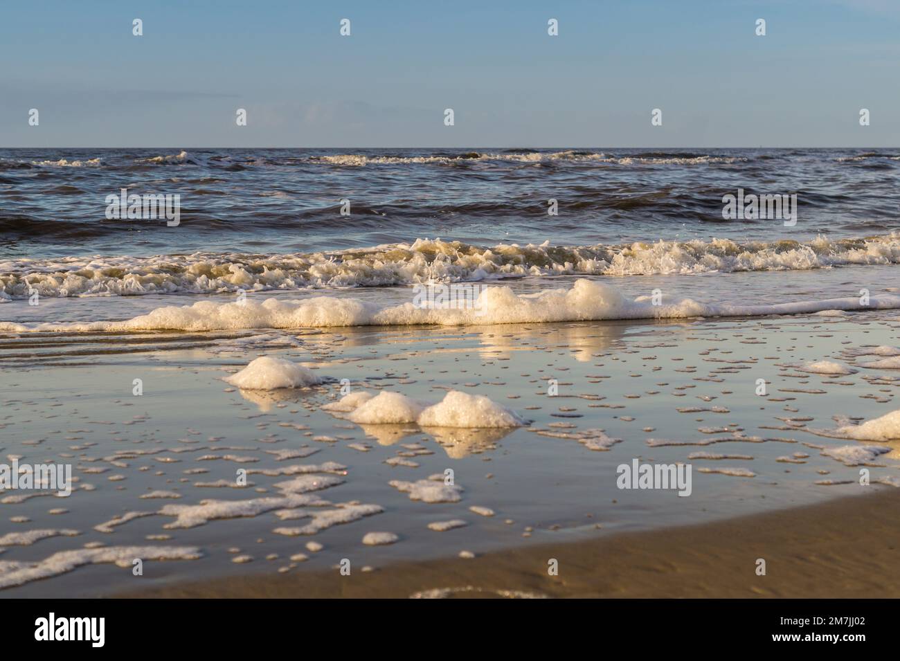 Foam on the beach at the North Sea Stock Photo - Alamy