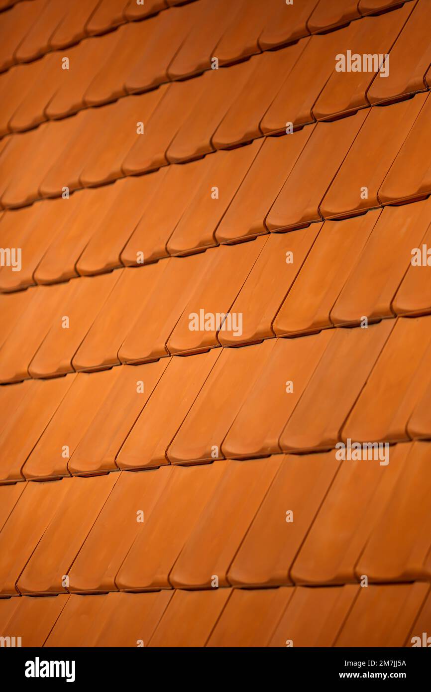 Details of orange brick tile roof patterns with clear bright blue sky ...