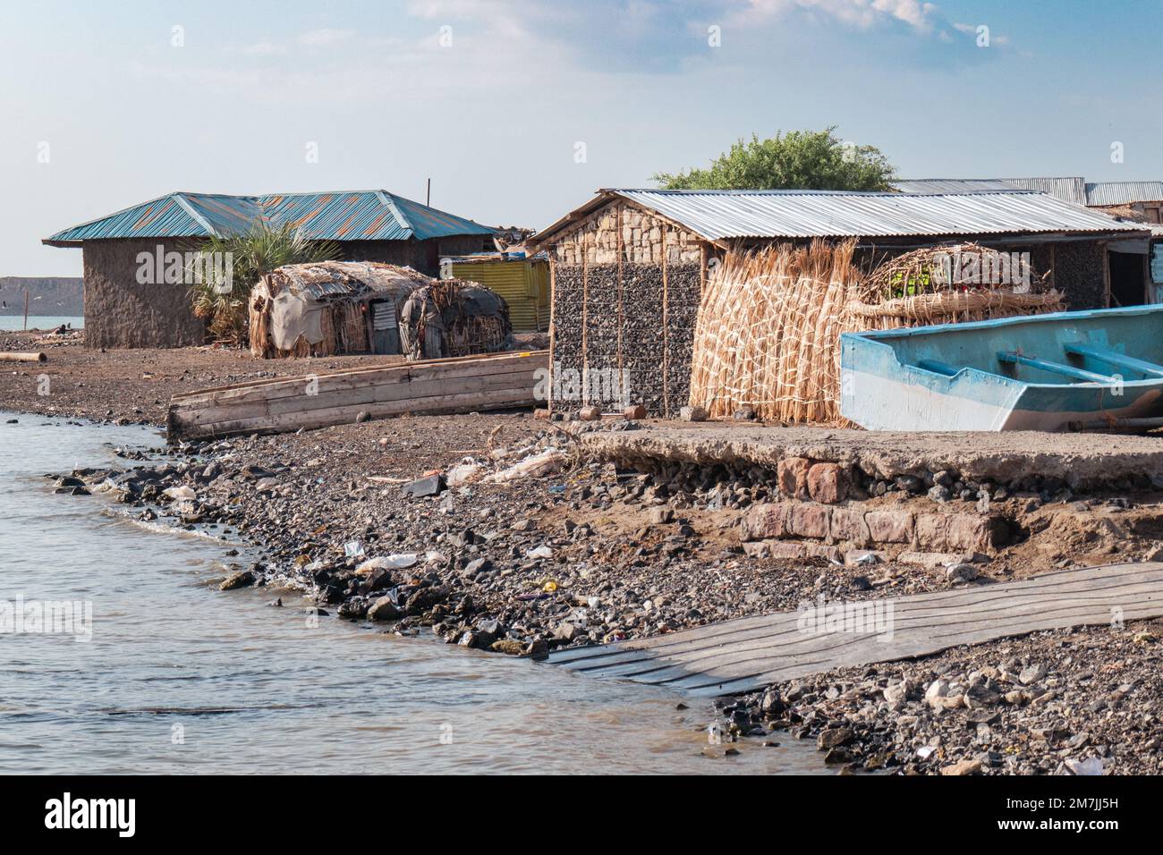 Traditional houses of the El Molo people in El Molo village living at ...