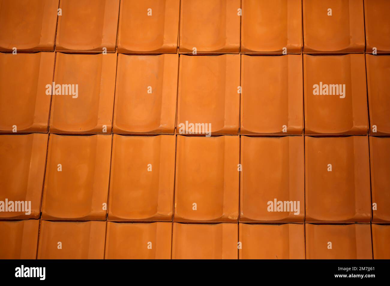 Details of orange brick tile roof patterns with clear bright blue sky ...