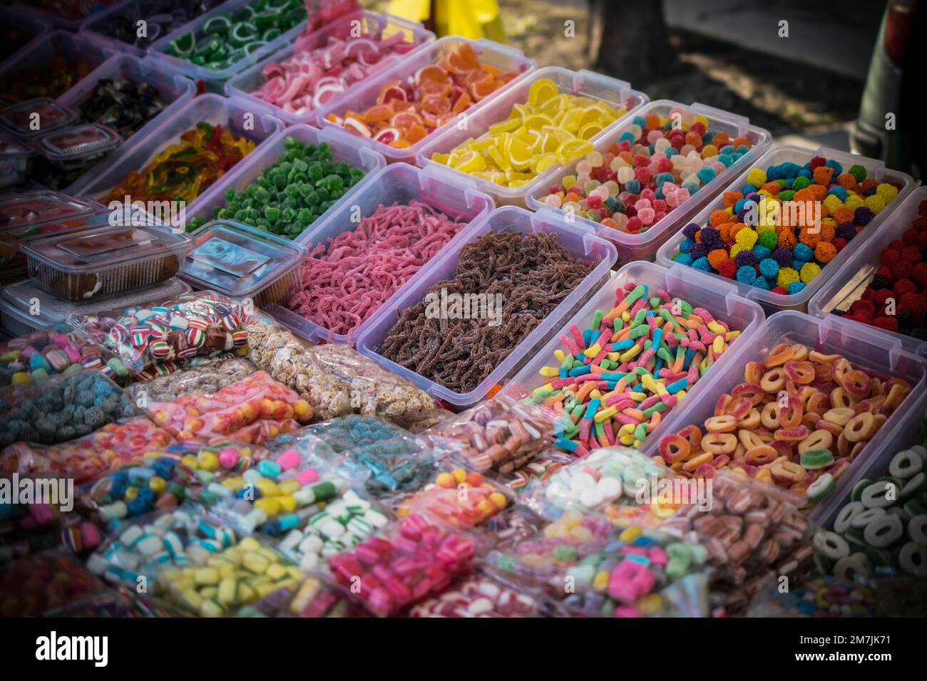 Assorted multicolored handmade sweets on the stall at the marketplace ...