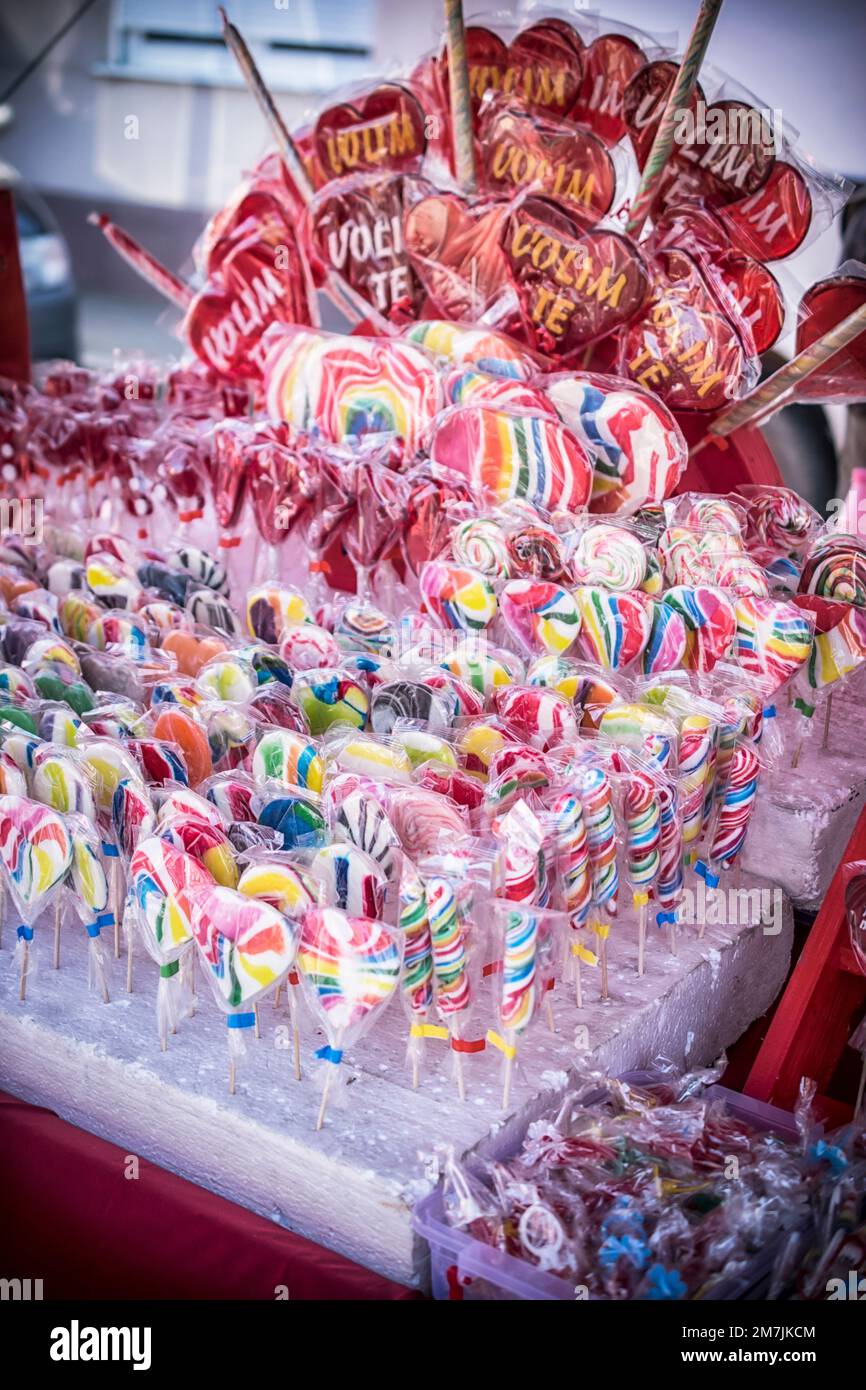 Assorted multicolored handmade sweets on the stall at the marketplace ...