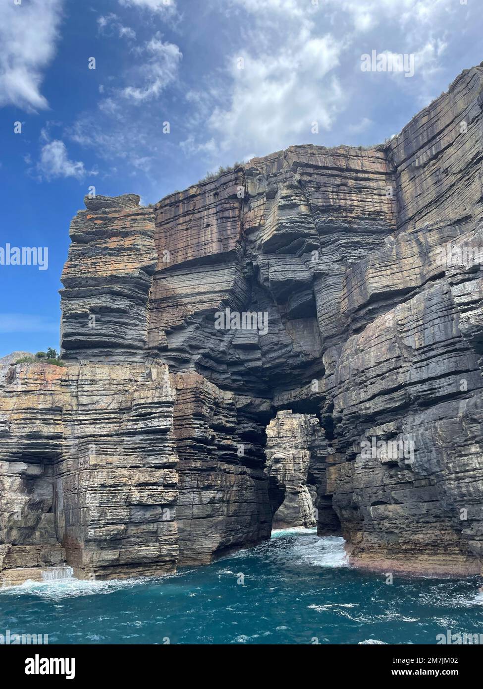 A low angle shot of a large cave in the ocean Stock Photo - Alamy