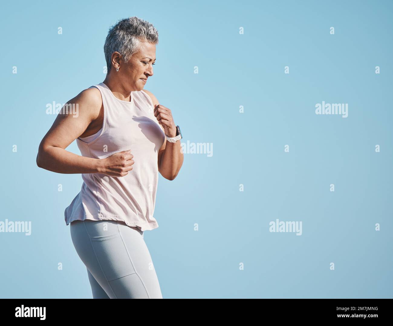 Fitness, running and senior woman in nature for health, wellness and ...