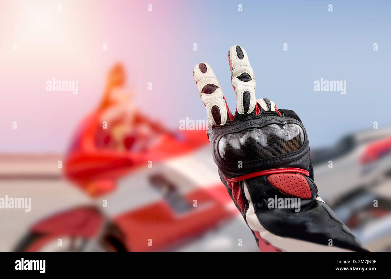 Gesture of biker greeting on the road. typical sign for greeting to ...