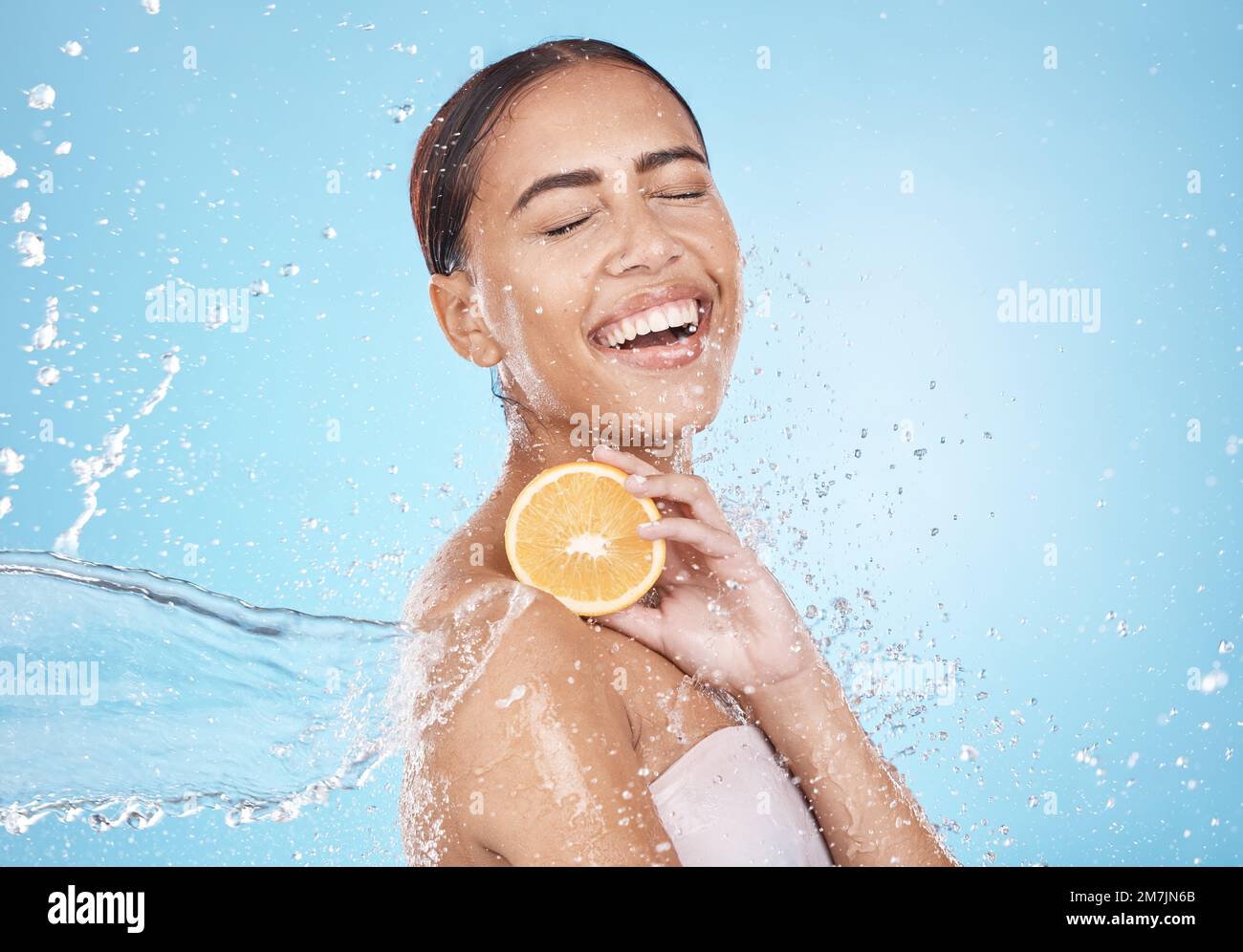 Water, lemon and woman with happy skincare, beauty or cosmetics product ...