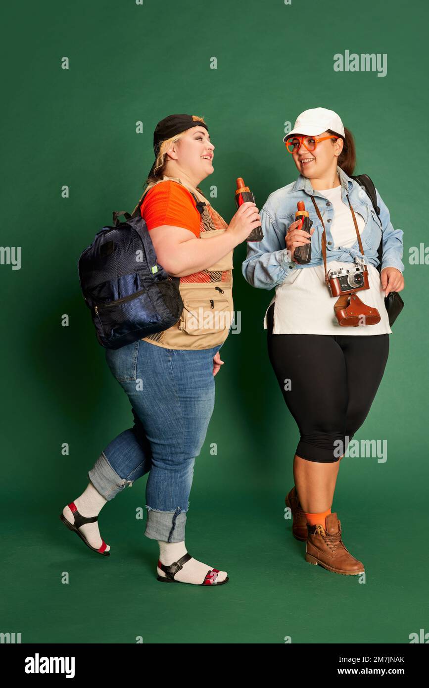 Portrait of two overweight women, friends in casual clothes with ...