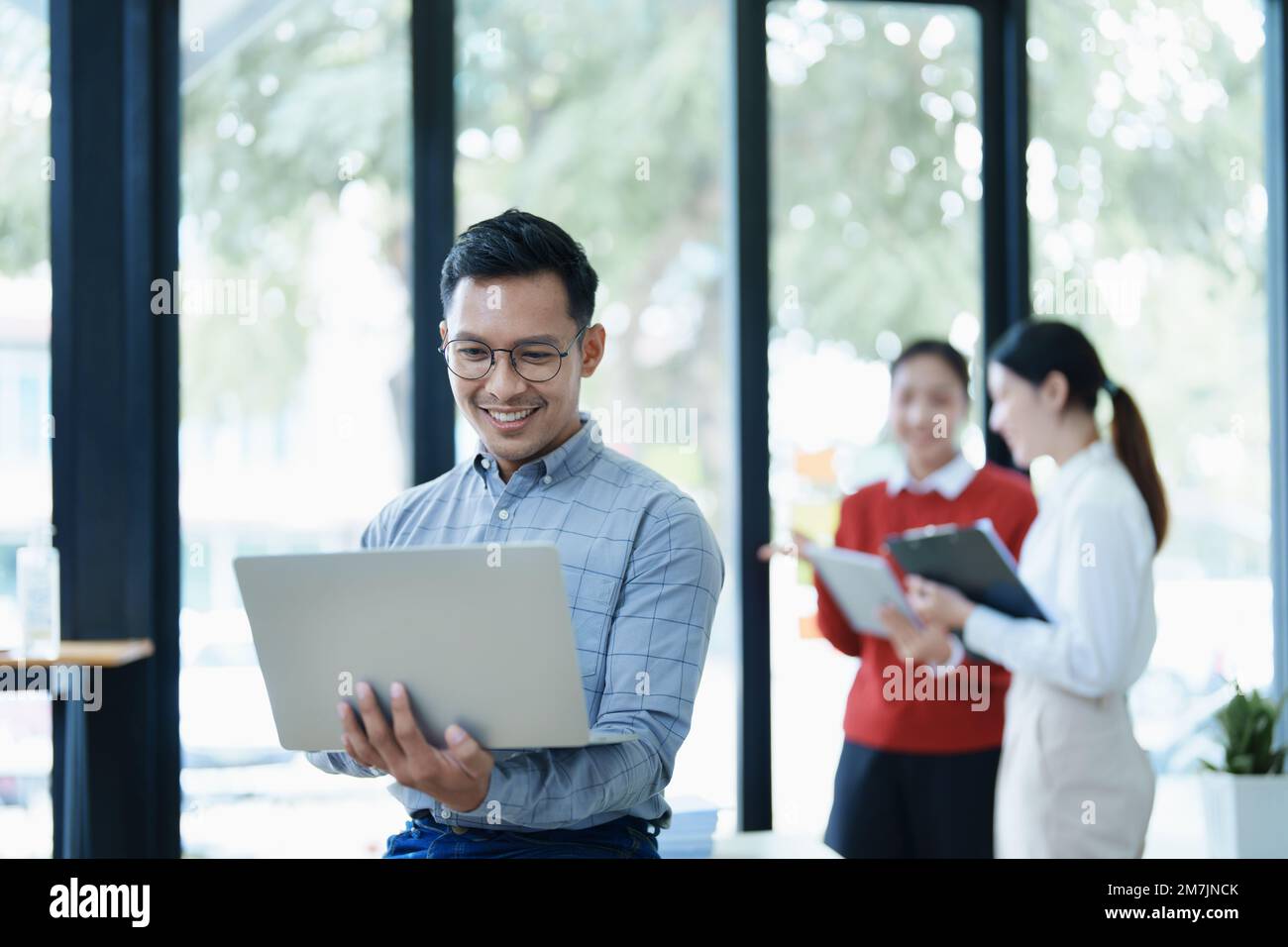 Portrait of a man business owner showing a happy smiling face as he has ...