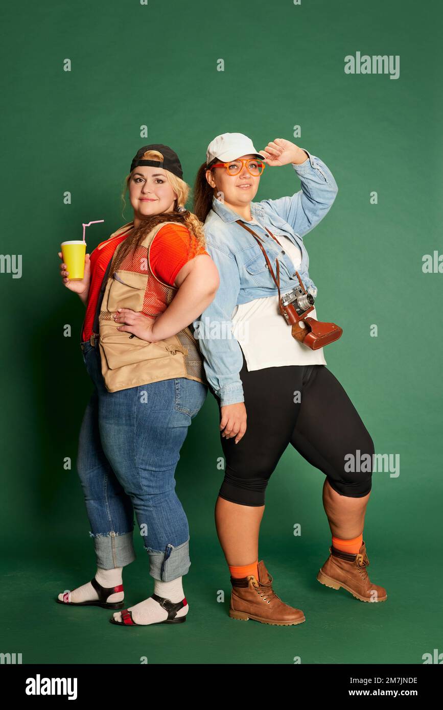 Portrait of two overweight women, friends in casual clothes with ...