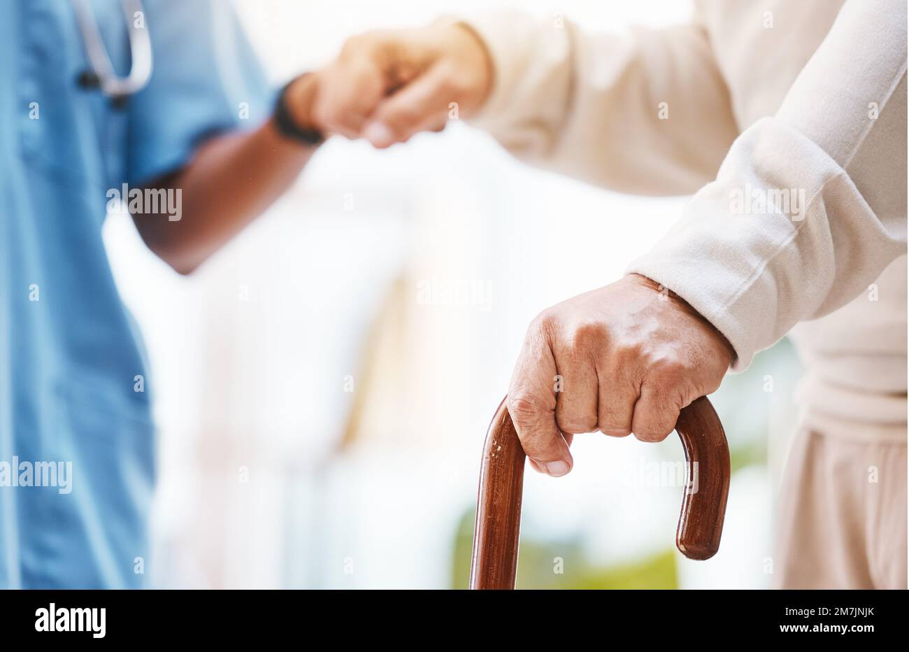 Nurse helping patient to walk hospital hi-res stock photography and images - Alamy