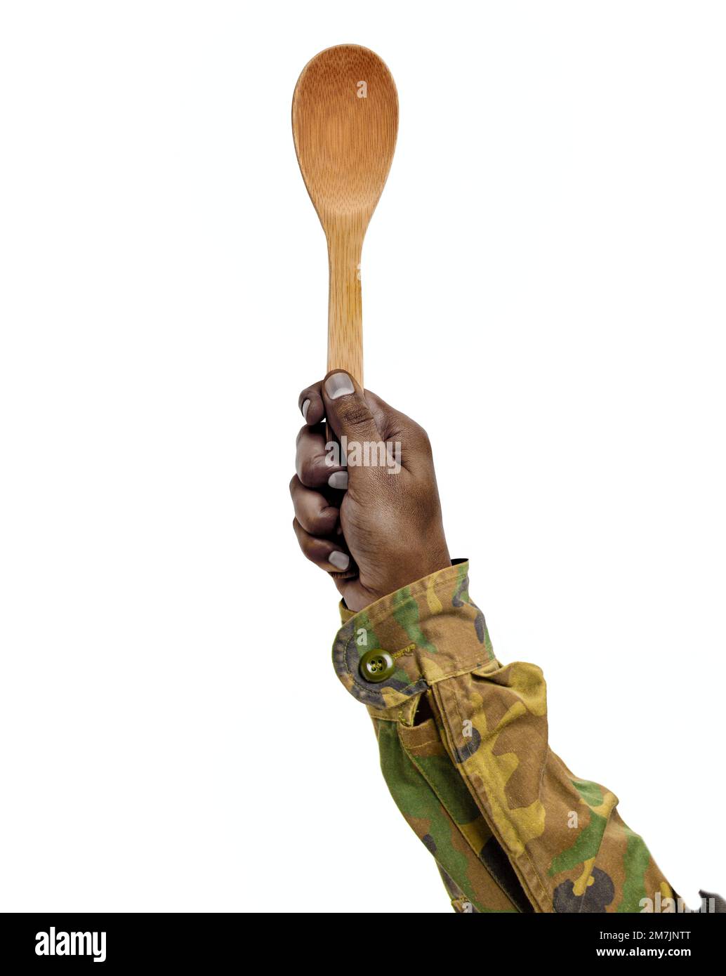 A chef arm holding wood spoon with white background Stock Photo - Alamy