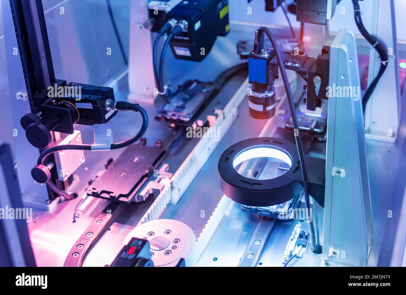 Robotic machine vision system in phone factory Stock Photo - Alamy
