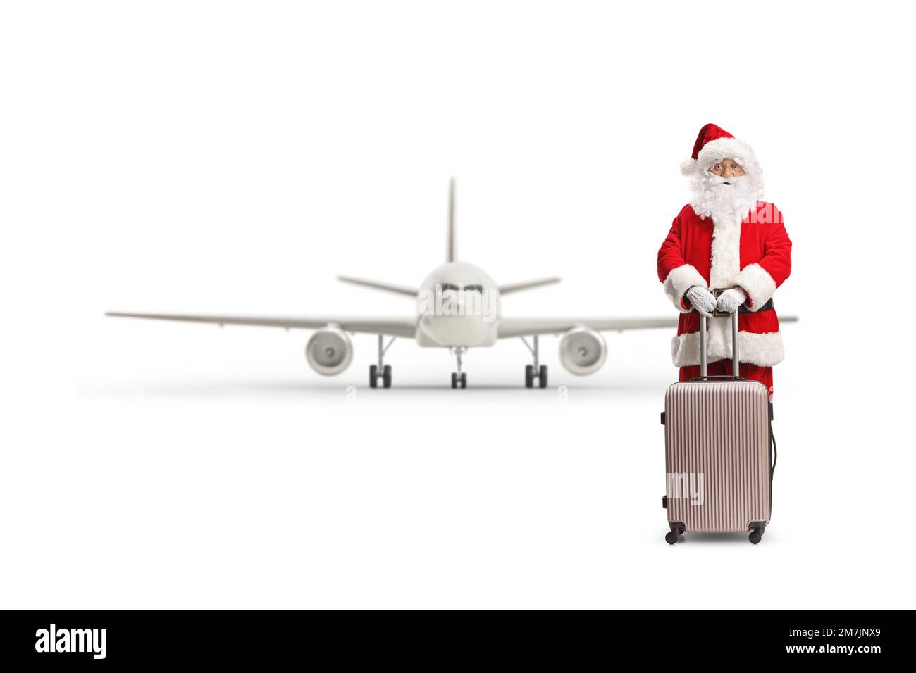 Full length portrait of santa claus standing with a suitcase in front ...